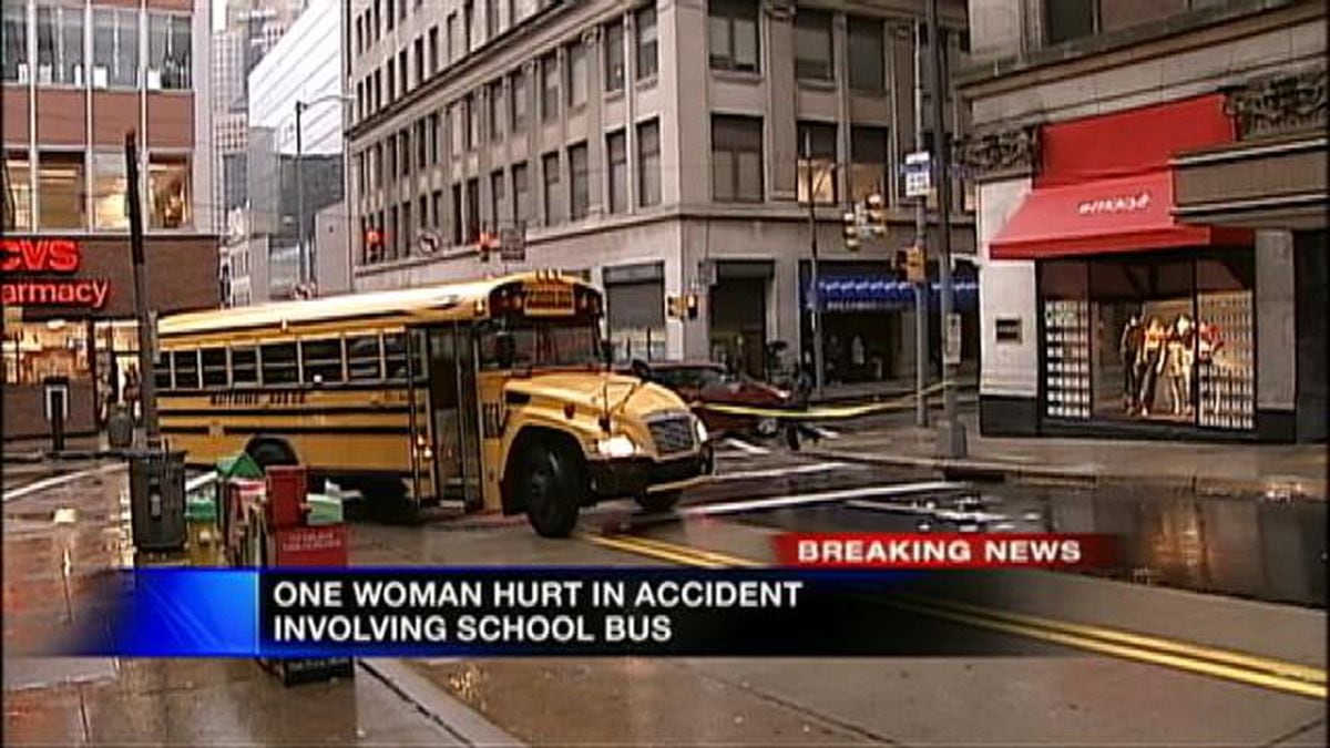 Woman hit by school bus downtown in critical condition